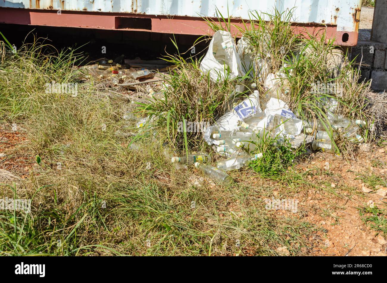 Bottles Dumped At The Back Of A Container Stock Photo - Alamy