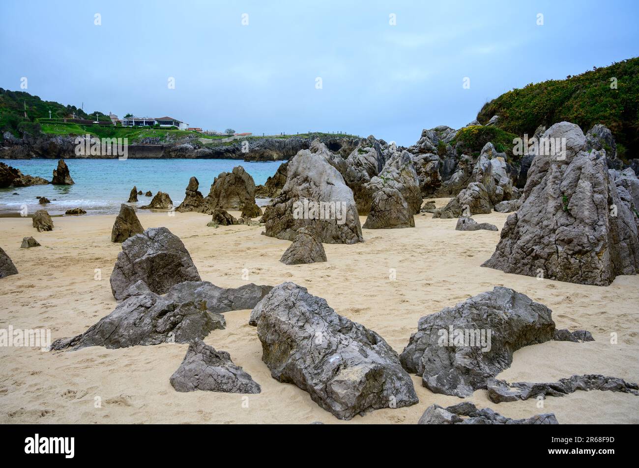 View on rocks on Playa de Toro in Llanes, Green coast of Asturias ...