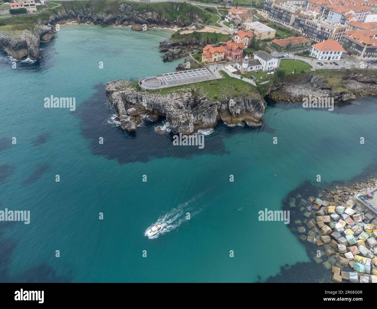 Aerial view on coastline and old harbour of Llanes, Green coast of ...