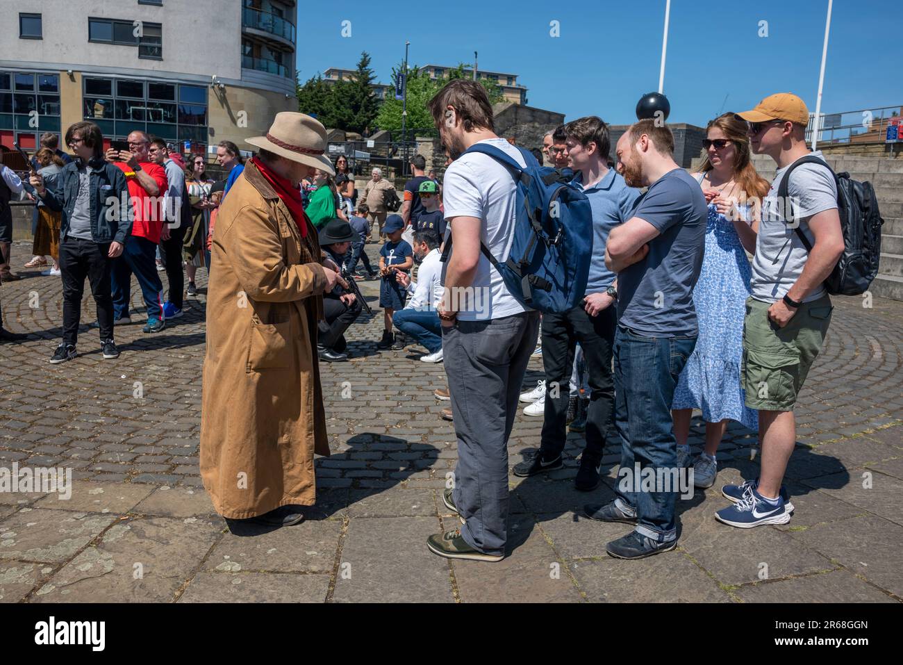Members of the public meet a member of the cast of an open air western ...