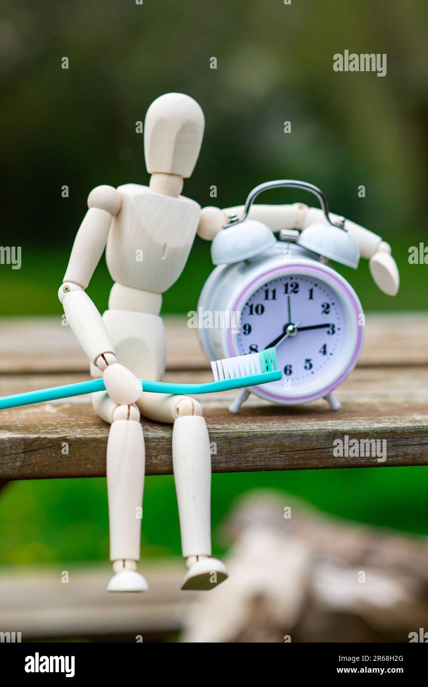 time to brush your teeth concept. Toothbrush in the hands of a human ...
