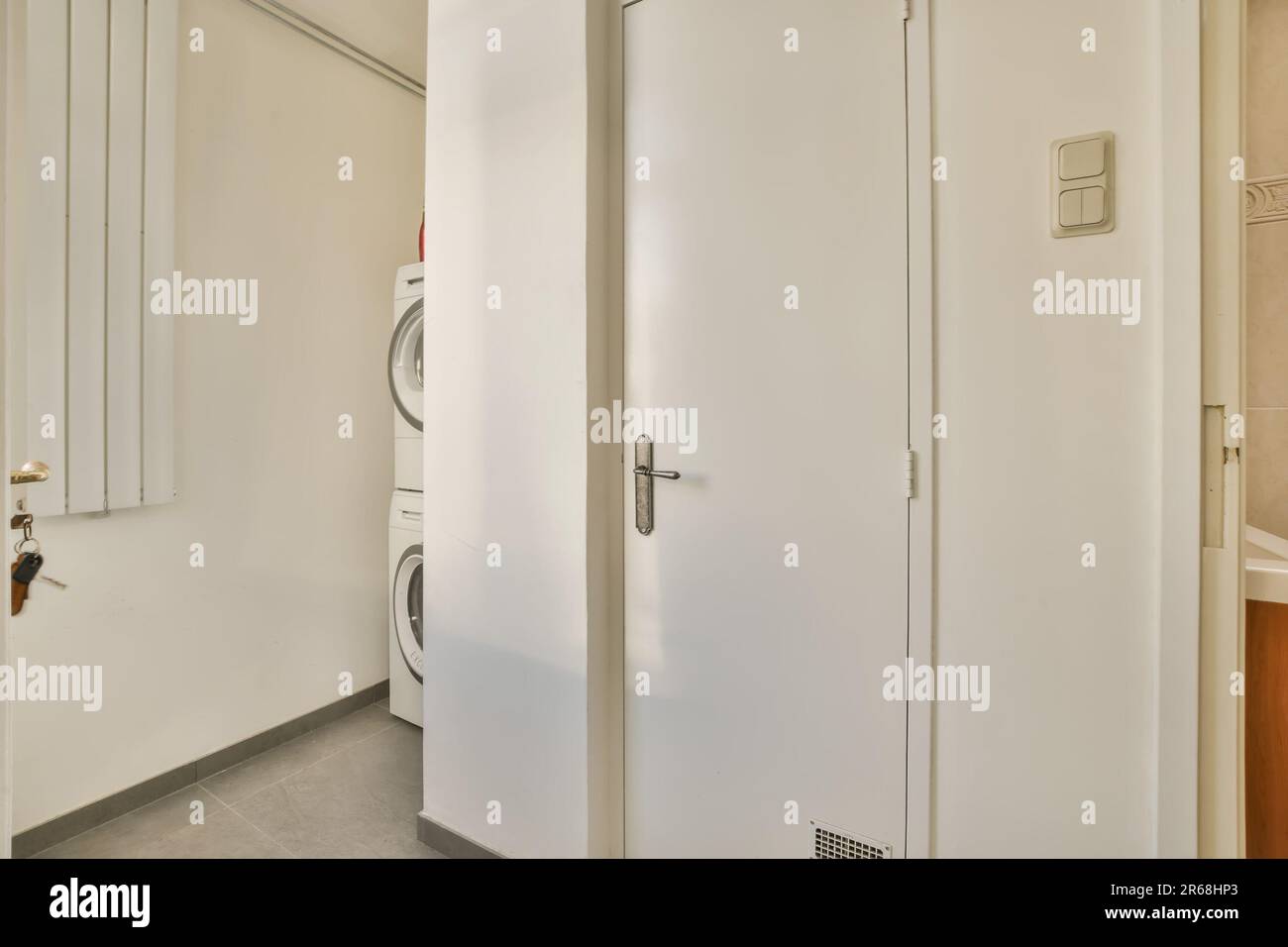 a laundry room with washer, dryer and washing machine in the corners on ...