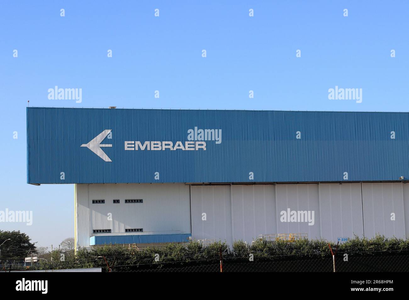 Embraer factory view against blue sky Stock Photo - Alamy