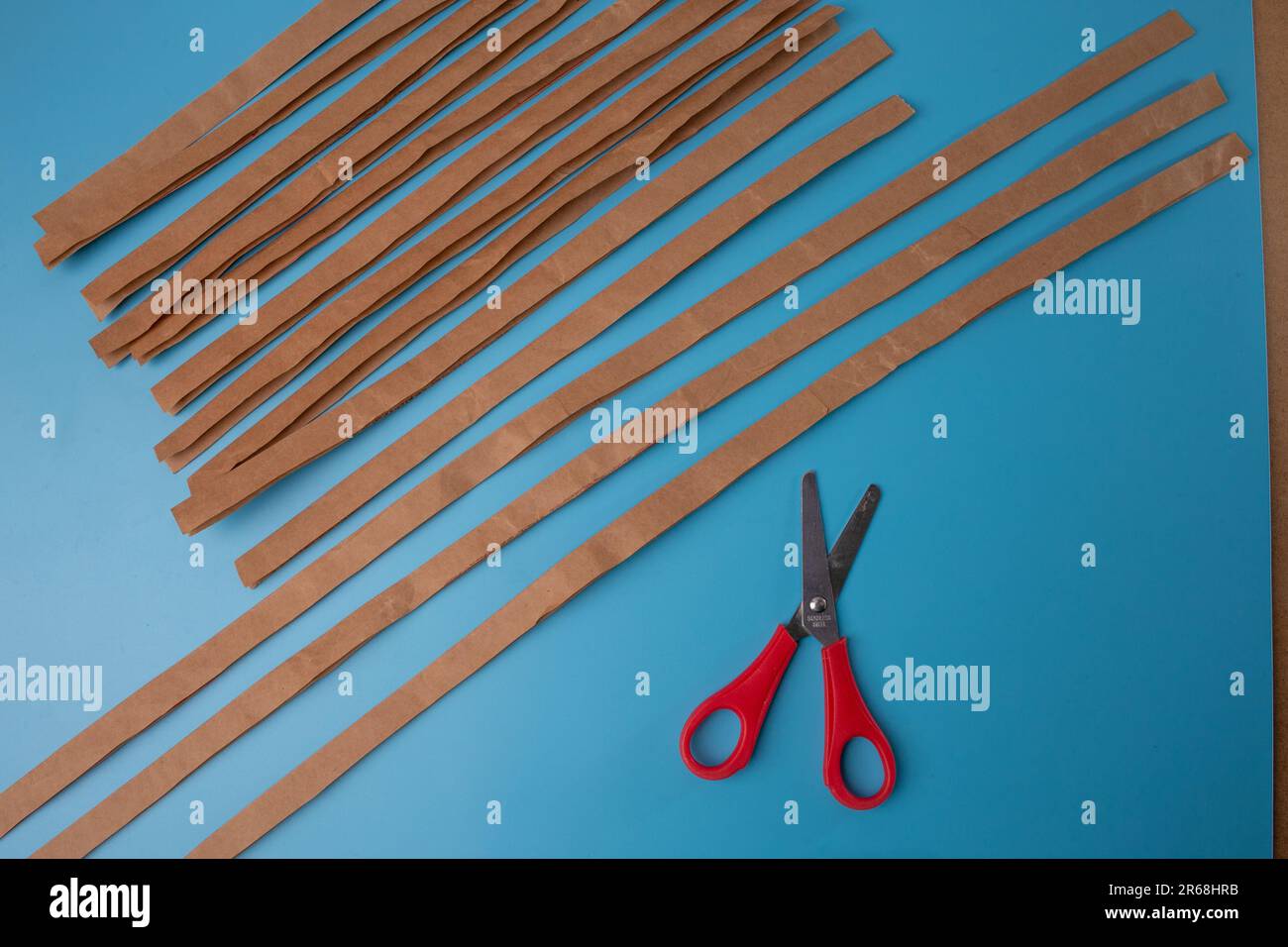 fold a strip of paper in half lengthwise Stock Photo - Alamy