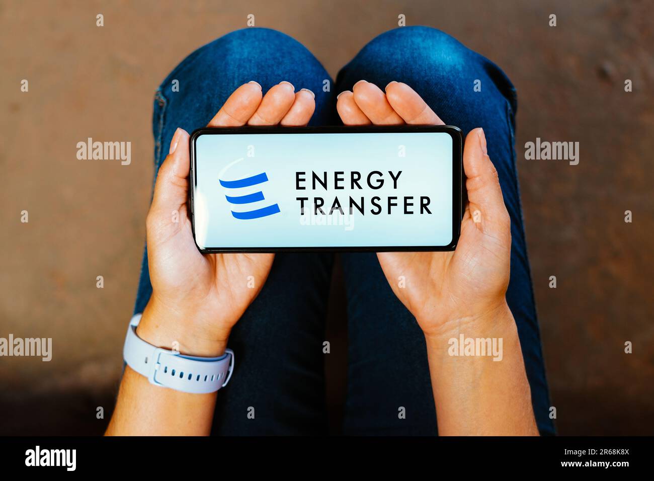 In this photo illustration, the Energy Transfer logo is displayed on a ...