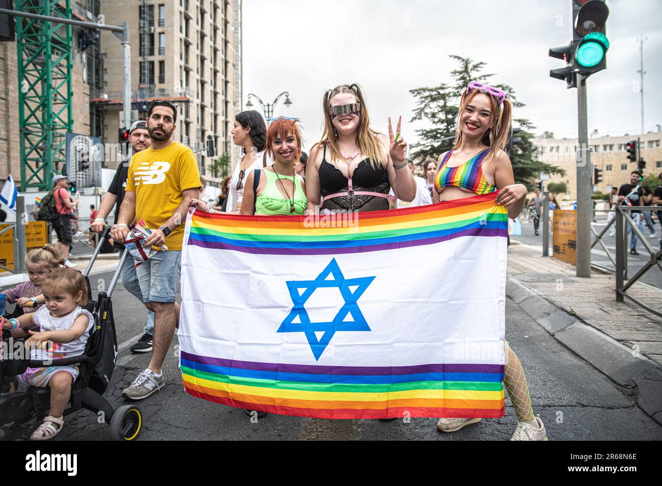 Participants pose with an Israeli rainbow flag during Jerusalem’s Pride ...