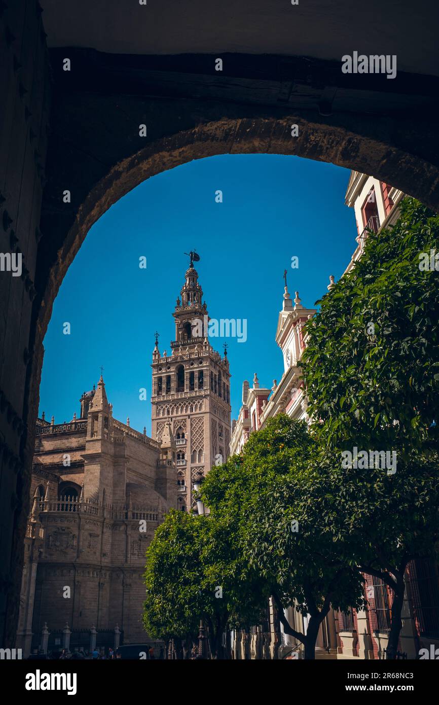 Image of the Giralda Tower of Seville through the streets of Seville ...