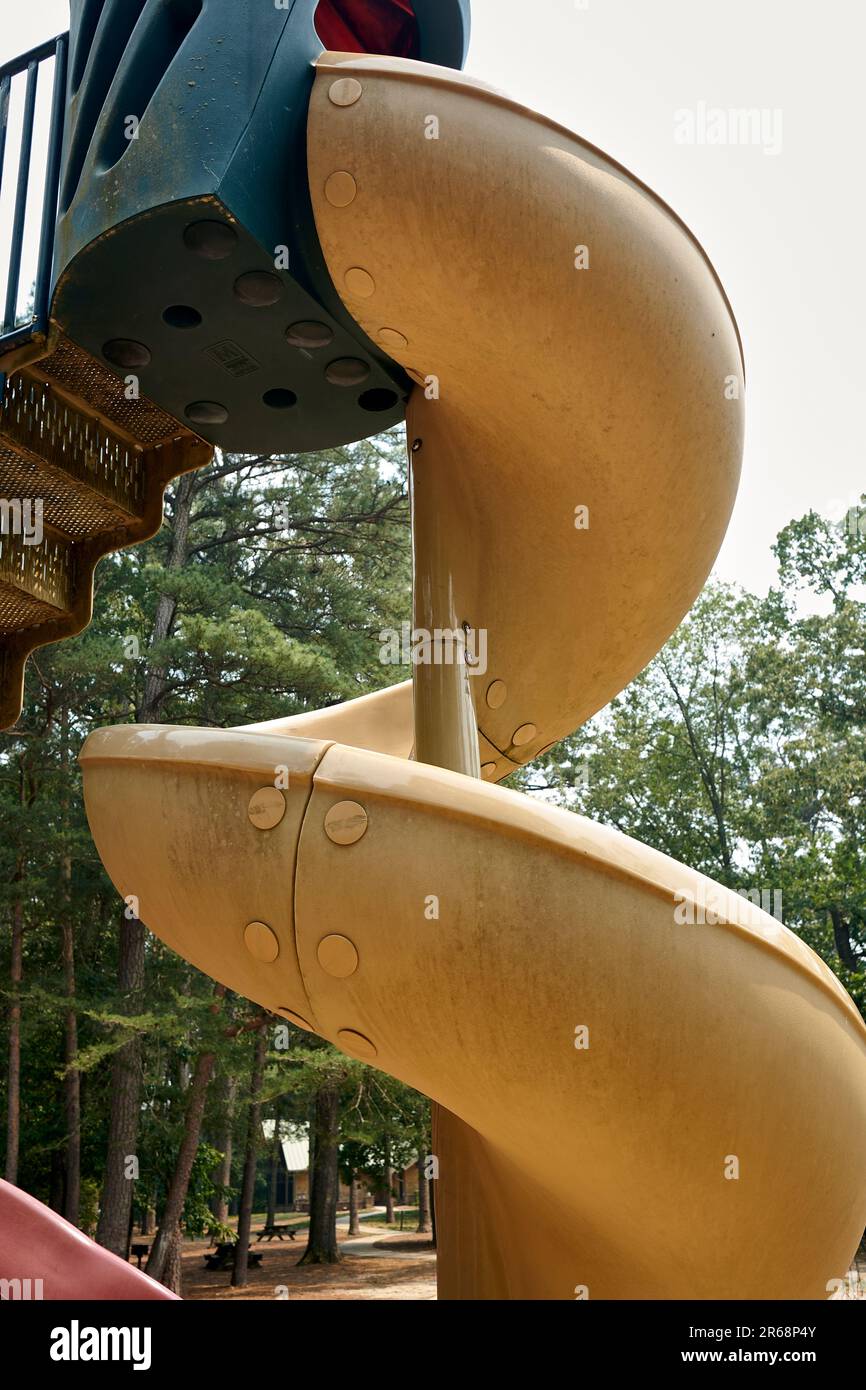 A plastic spiral playground slide for children Stock Photo - Alamy