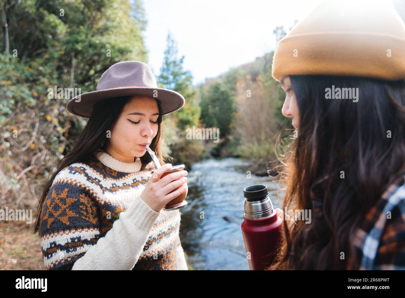 Two Cheerful Young Women Bonding and Drinking Yerba Mate in a Rural ...