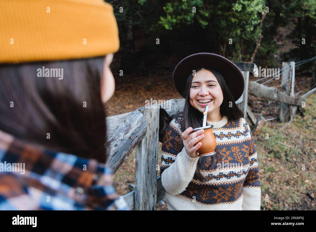 Two Cheerful Young Women Delighting in Yerba Mate Ritual at Countryside ...