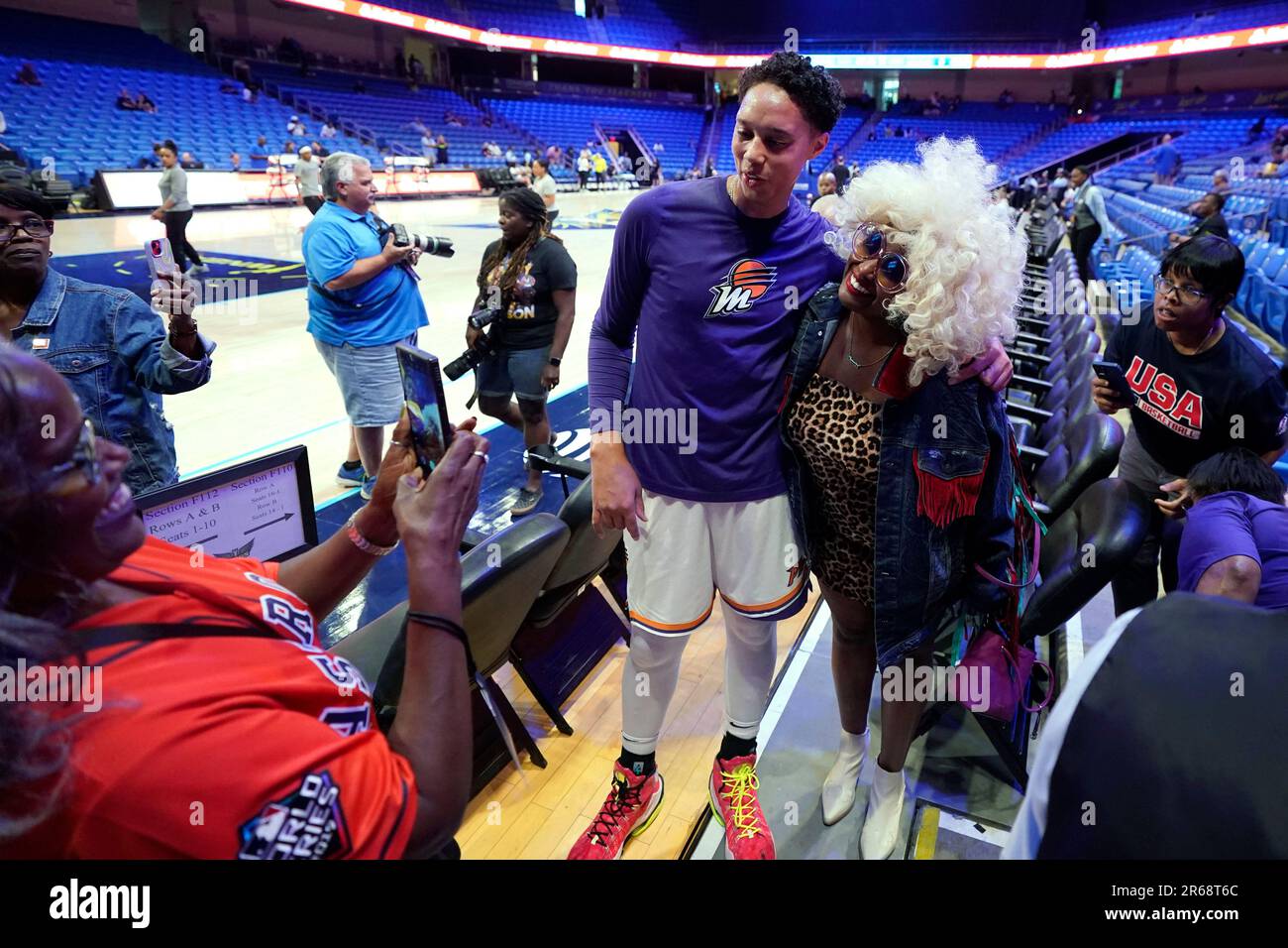 Phoenix Mercury center Brittney Griner, center, poses for a photo with ...