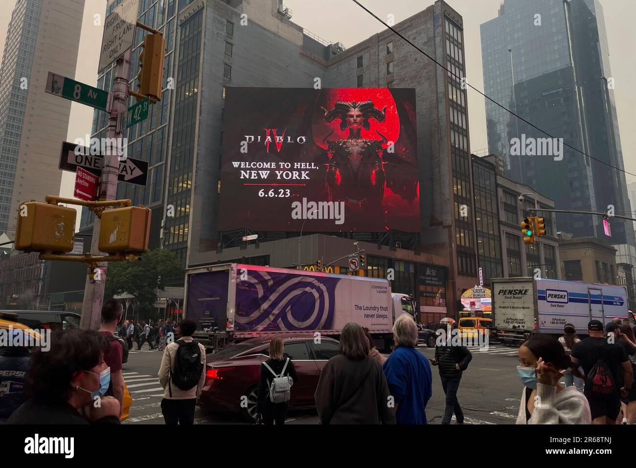 Seen through a smokey haze from Canadian wildfires, a billboard ...