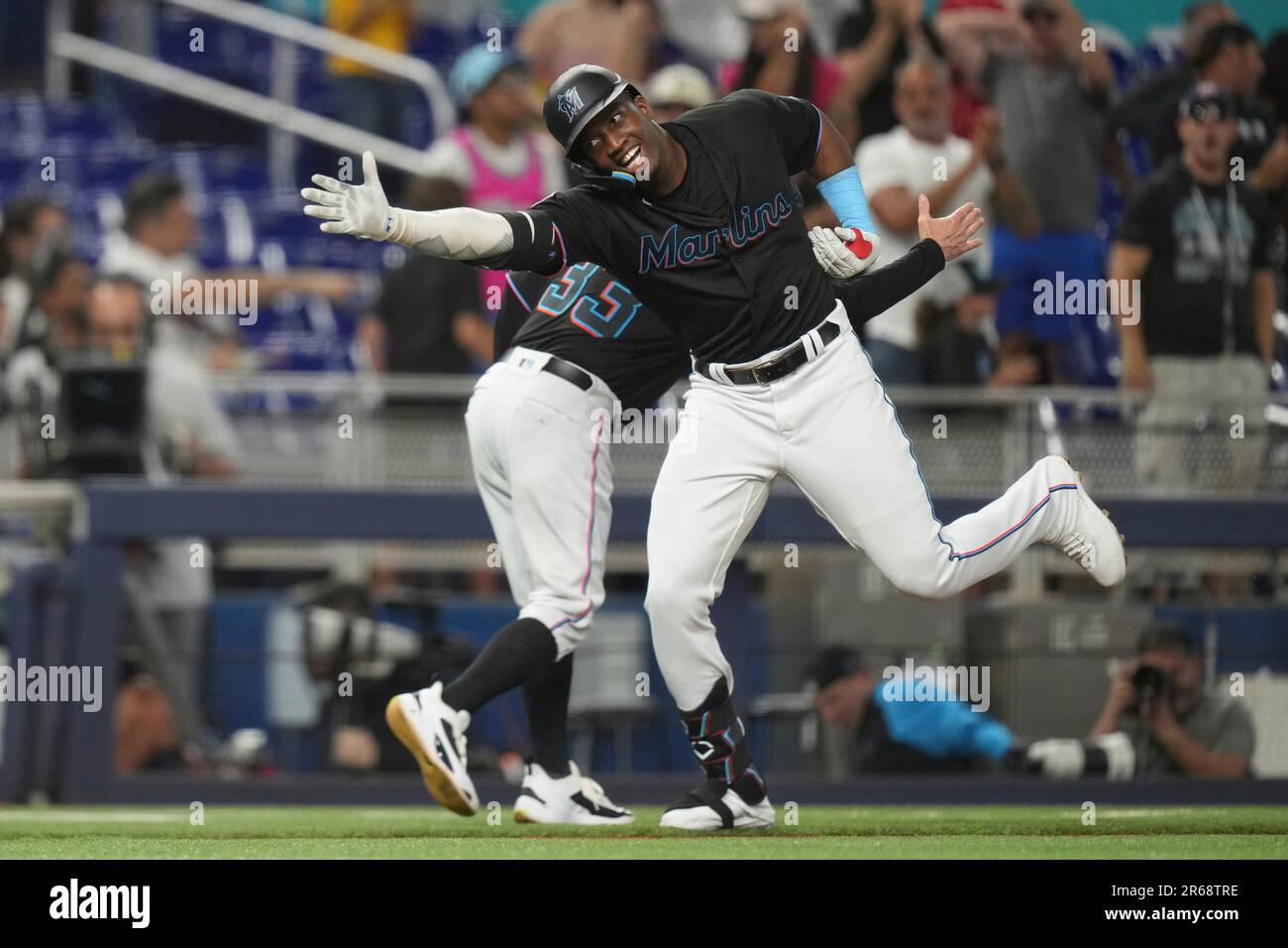 Miami Marlins' Jesus Sanchez celebrates with third base coach Jody Reed ...