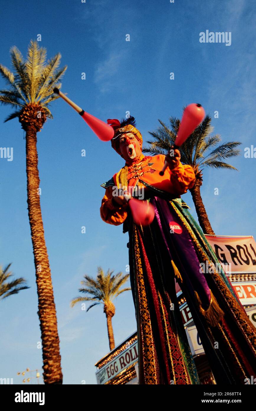 Juggling clown on stilts performing in Florida Stock Photo - Alamy