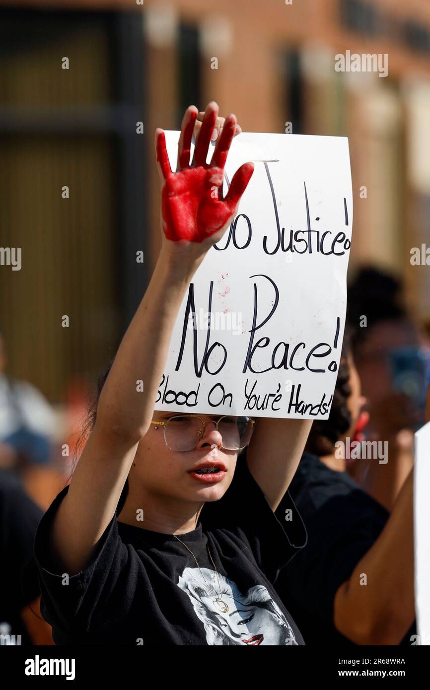 Community members gather in protest near the site of The Davenport ...