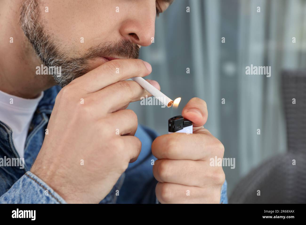 Man lighting cigarette hi-res stock photography and images - Alamy