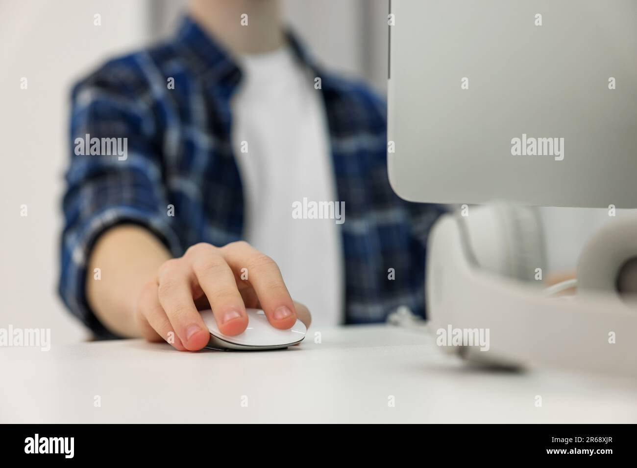 Teenage boy using computer indoors, closeup. Internet addiction Stock ...