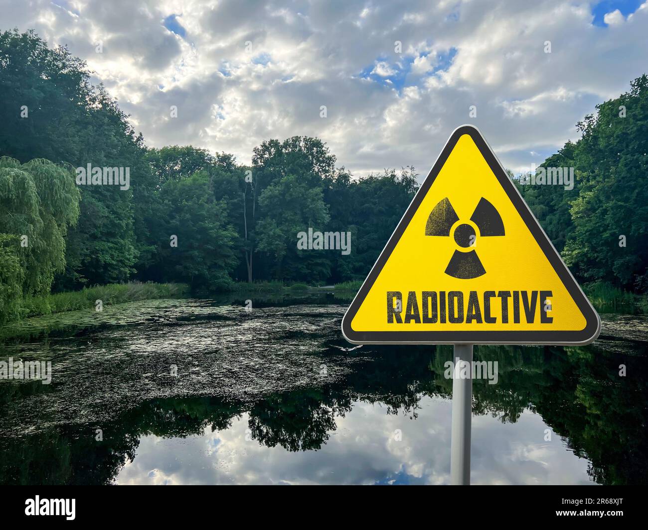 Radioactive pollution. Yellow warning sign with hazard symbol near ... Radioactive pollution. Yellow warning sign with hazard symbol near ...