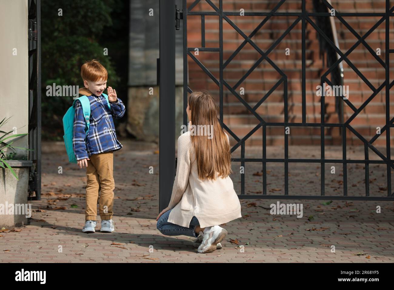 Boy backpack goodbye hi-res stock photography and images - Alamy