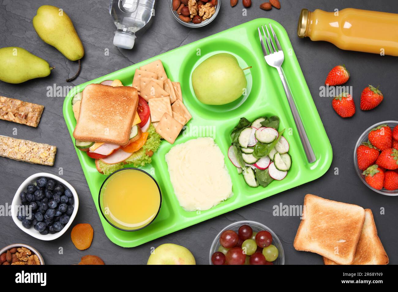 Flat lay composition with serving tray and tasty healthy food on grey ...