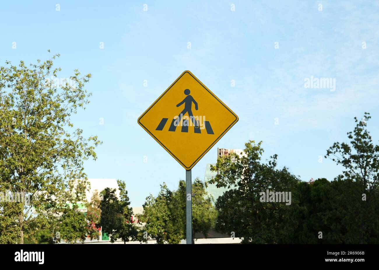Different road signs on city street against blue sky Stock Photo - Alamy