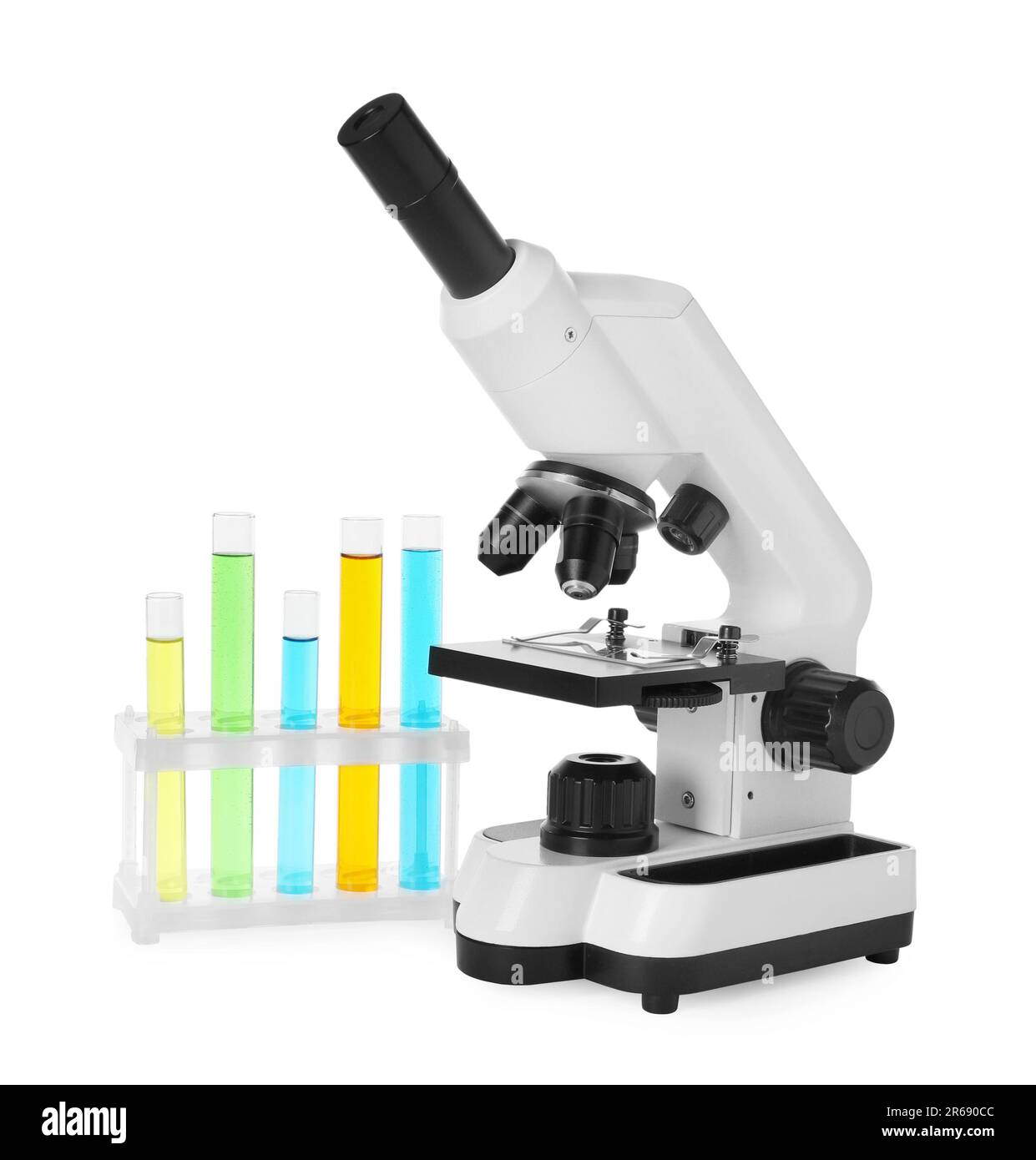 Test tubes with colorful liquids and microscope isolated on white Stock ...