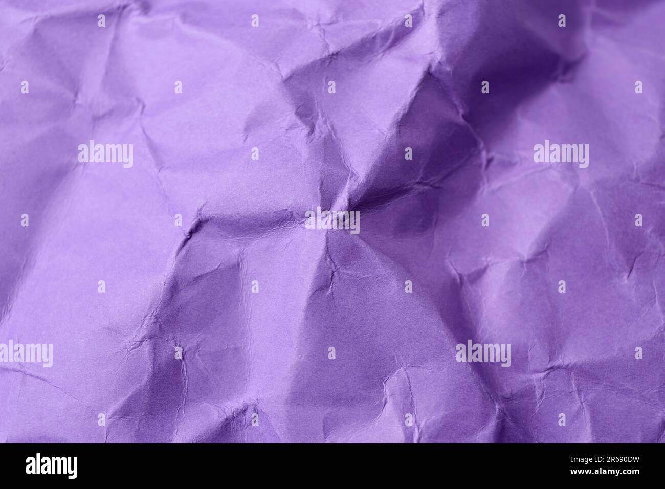 Sheet of crumpled violet paper as background, top view Stock Photo - Alamy