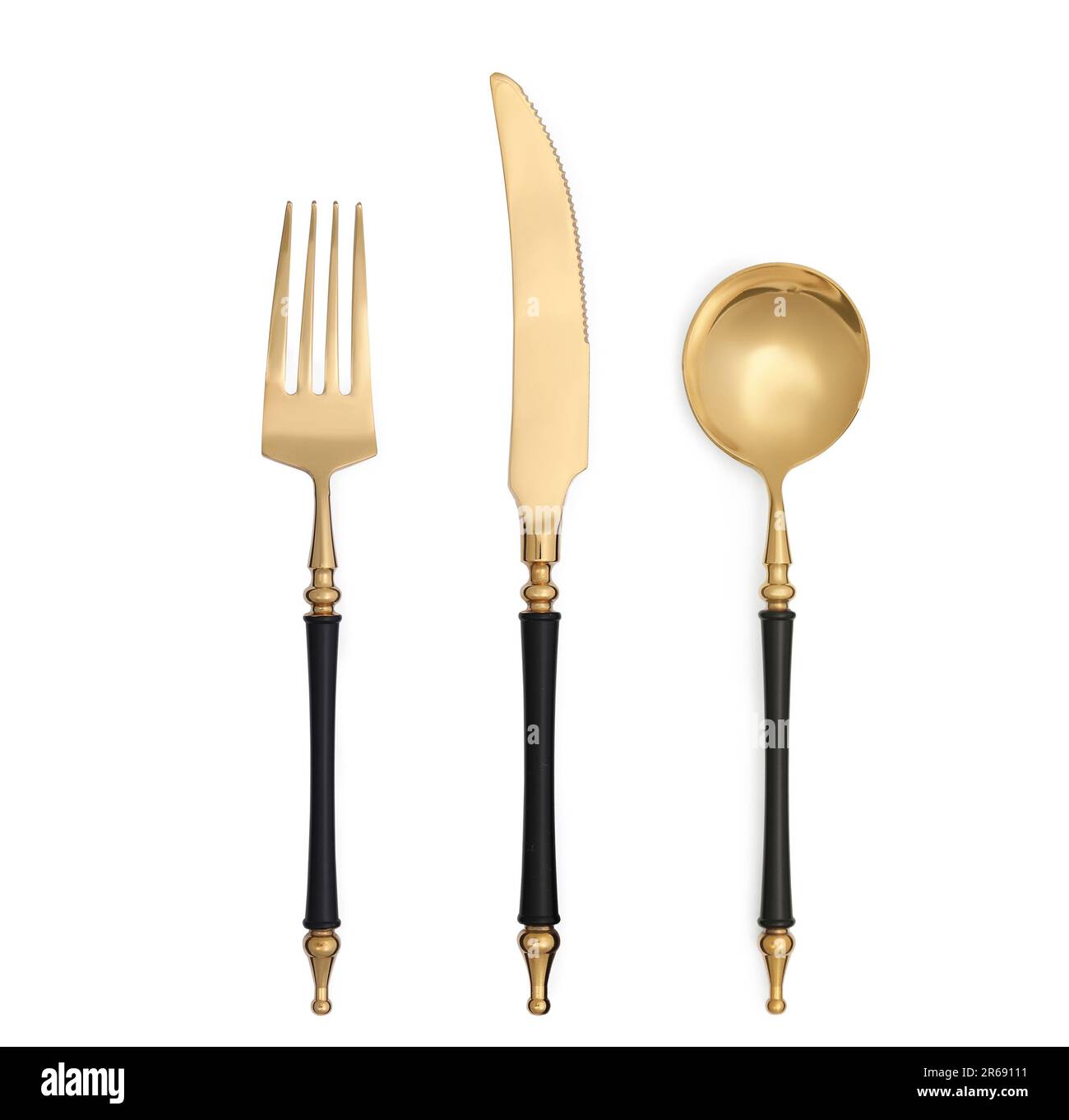 Stylish golden cutlery set on white background, top view Stock Photo ...