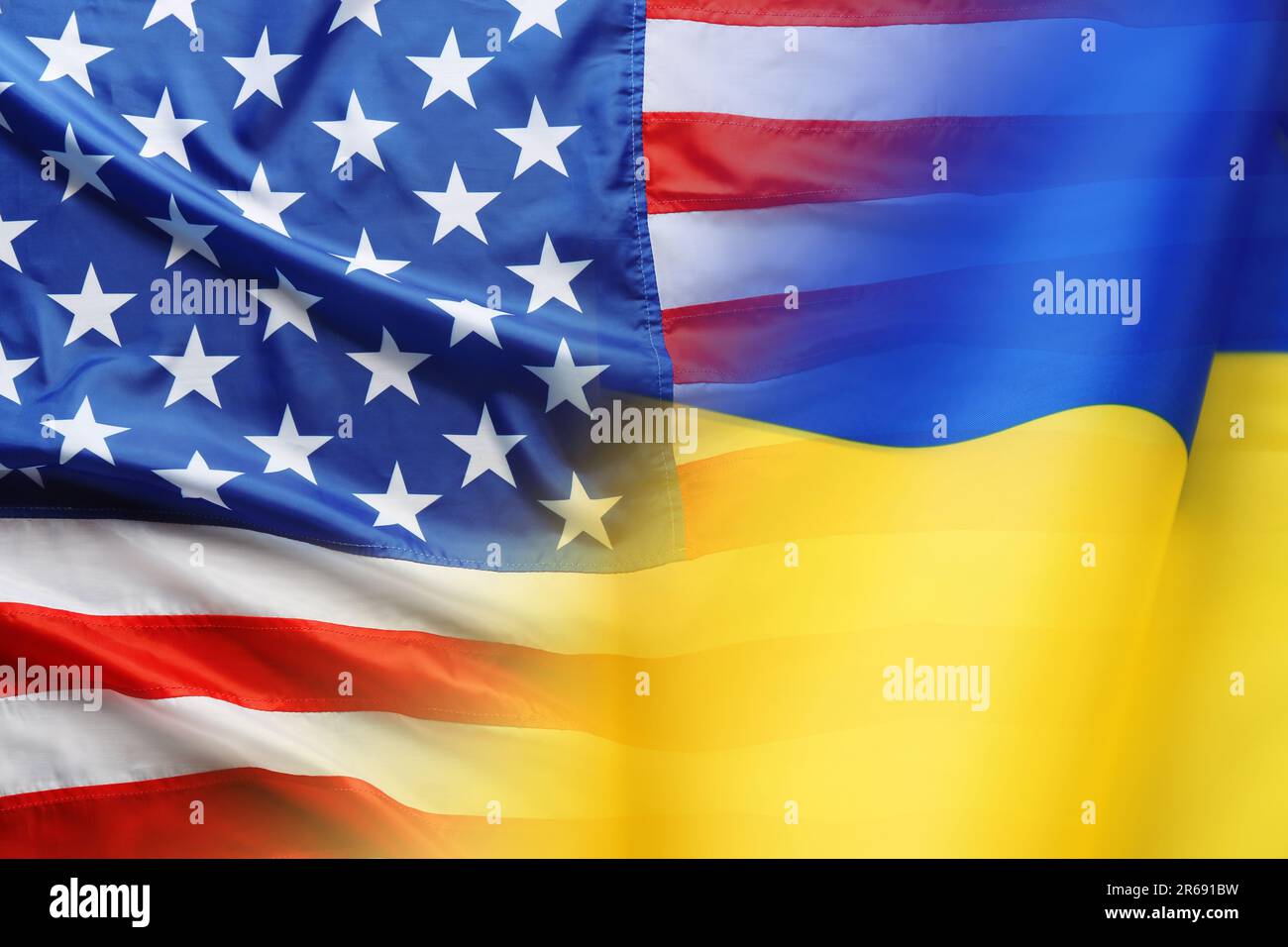 National flags of Ukraine and USA symbolizing partnership between ...