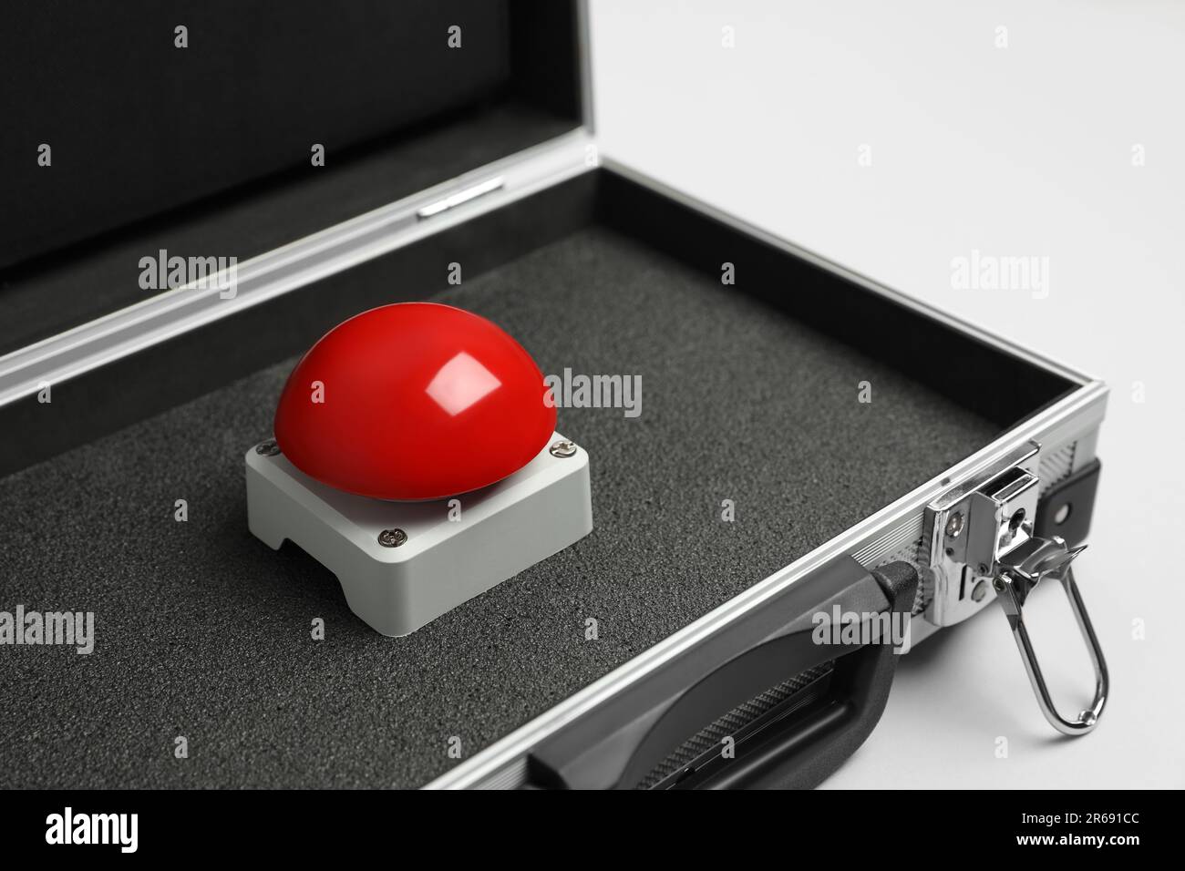 Red button of nuclear weapon in suitcase on white background. War ...