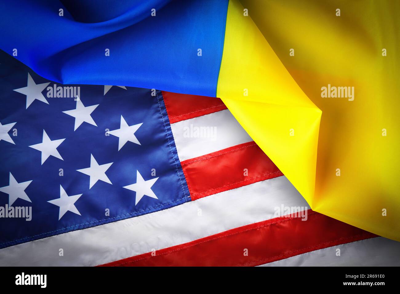 National flags of Ukraine and USA symbolizing partnership between ...