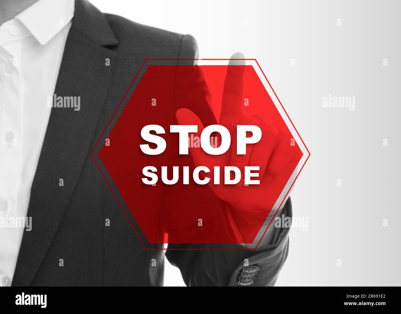 Woman touching warning sign with phrase Stop Suicide on white ...
