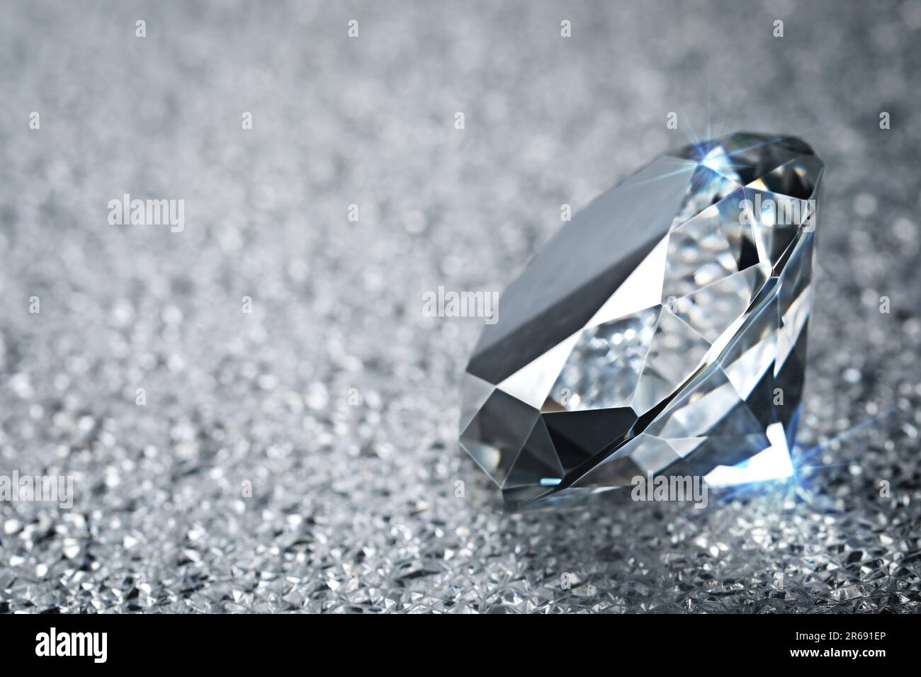 Beautiful diamond on shiny silver background, closeup. Space for text ...