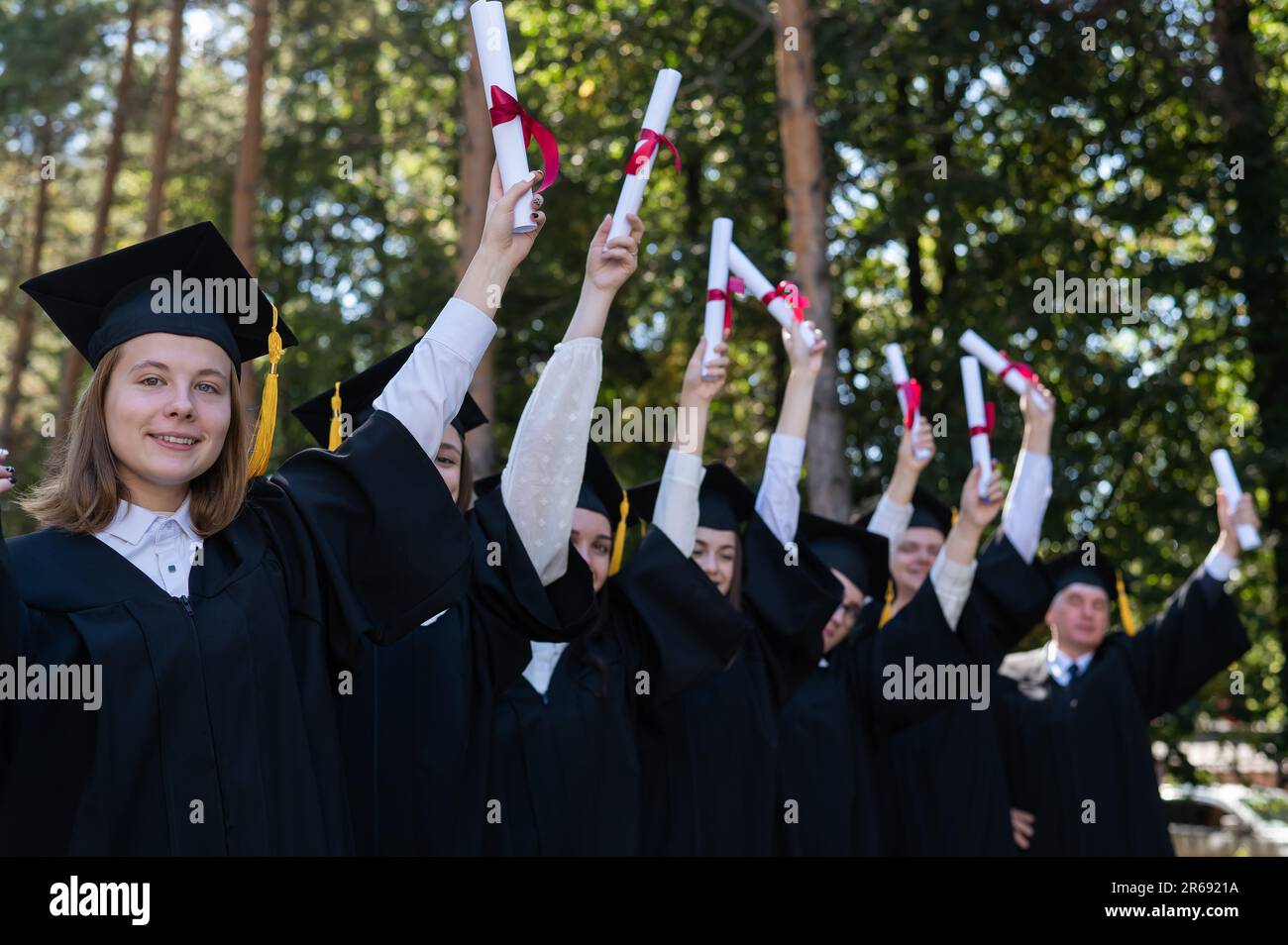Diplomas in hands hi-res stock photography and images - Alamy