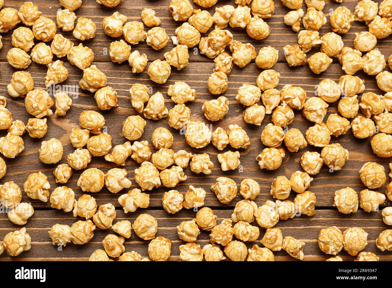 Crispy popcorn on wooden background Stock Photo - Alamy