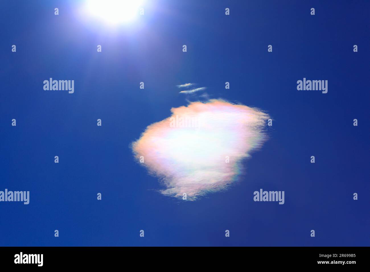 Iridescent clouds and the Sun Stock Photo - Alamy