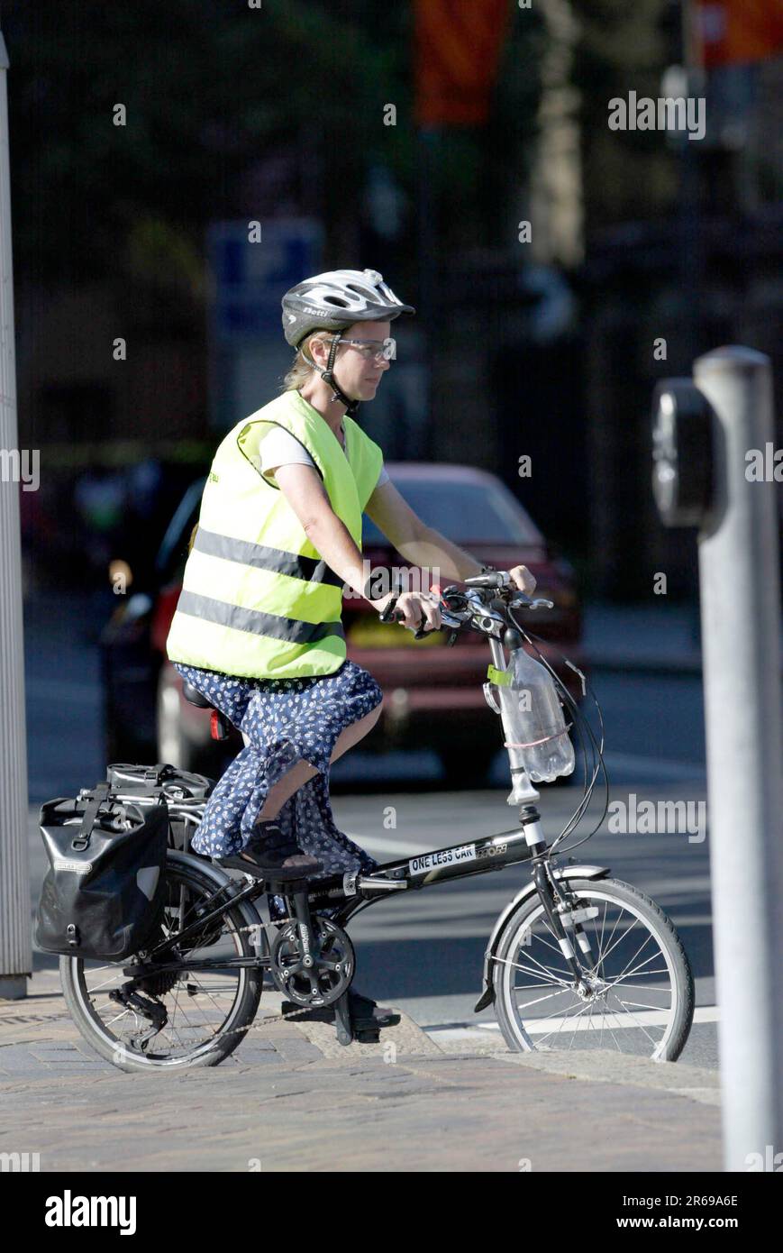 A cyclist with a bike bearing the 'One Less Car' slogan on Macquarie ...