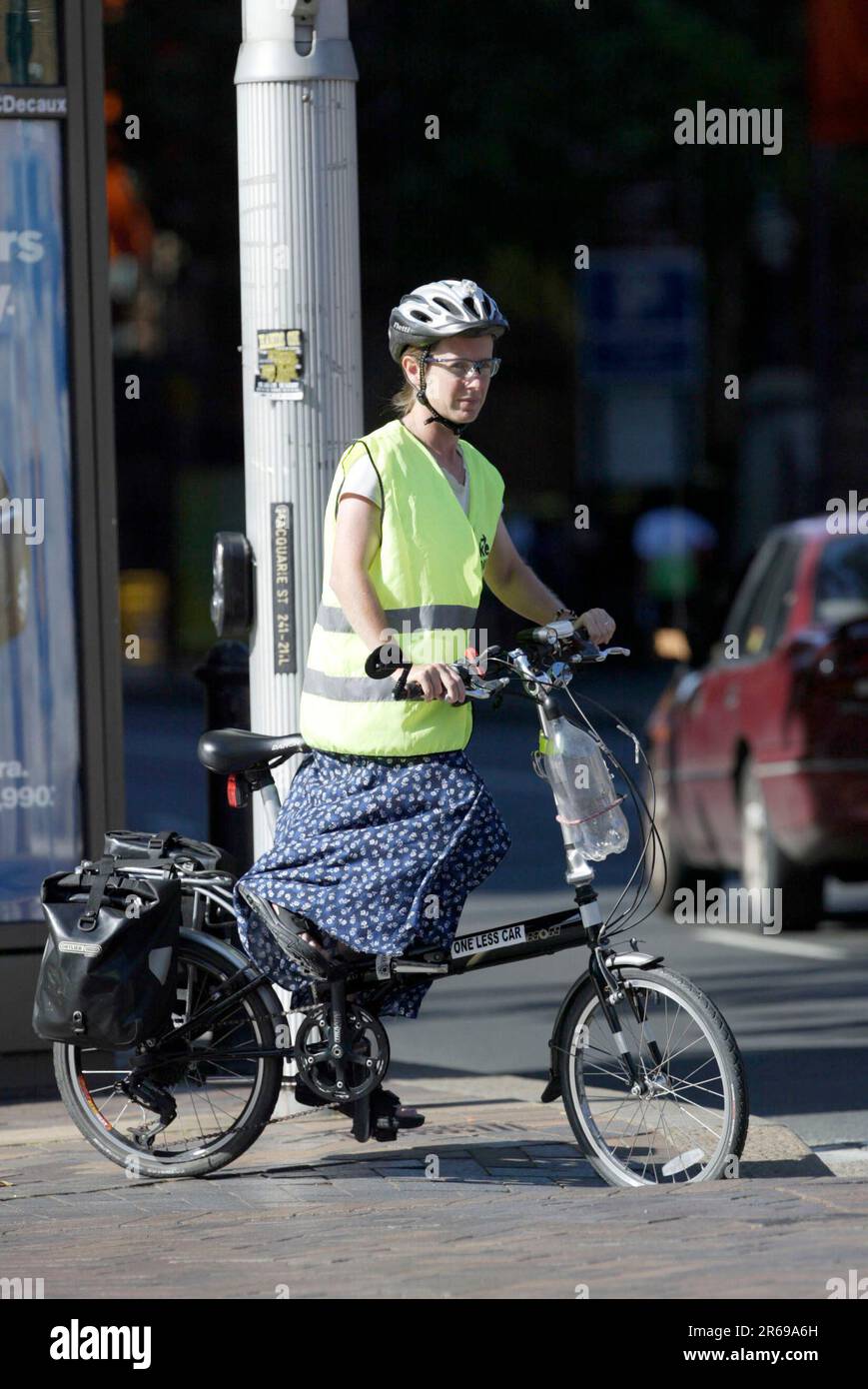 A cyclist with a bike bearing the 'One Less Car' slogan on Macquarie ...