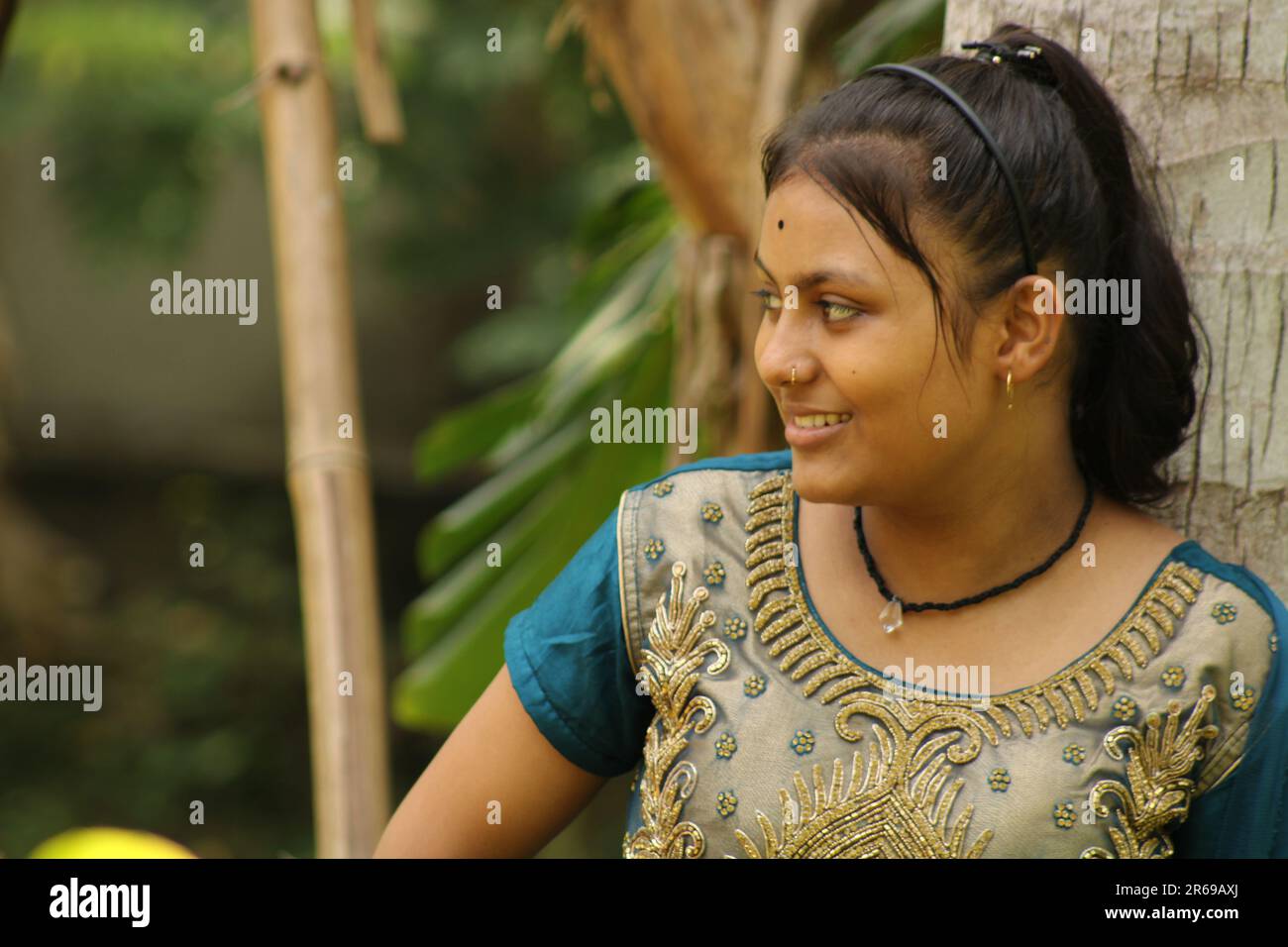 A young beautiful Indian Teenage girl portrait with smiling expression ...