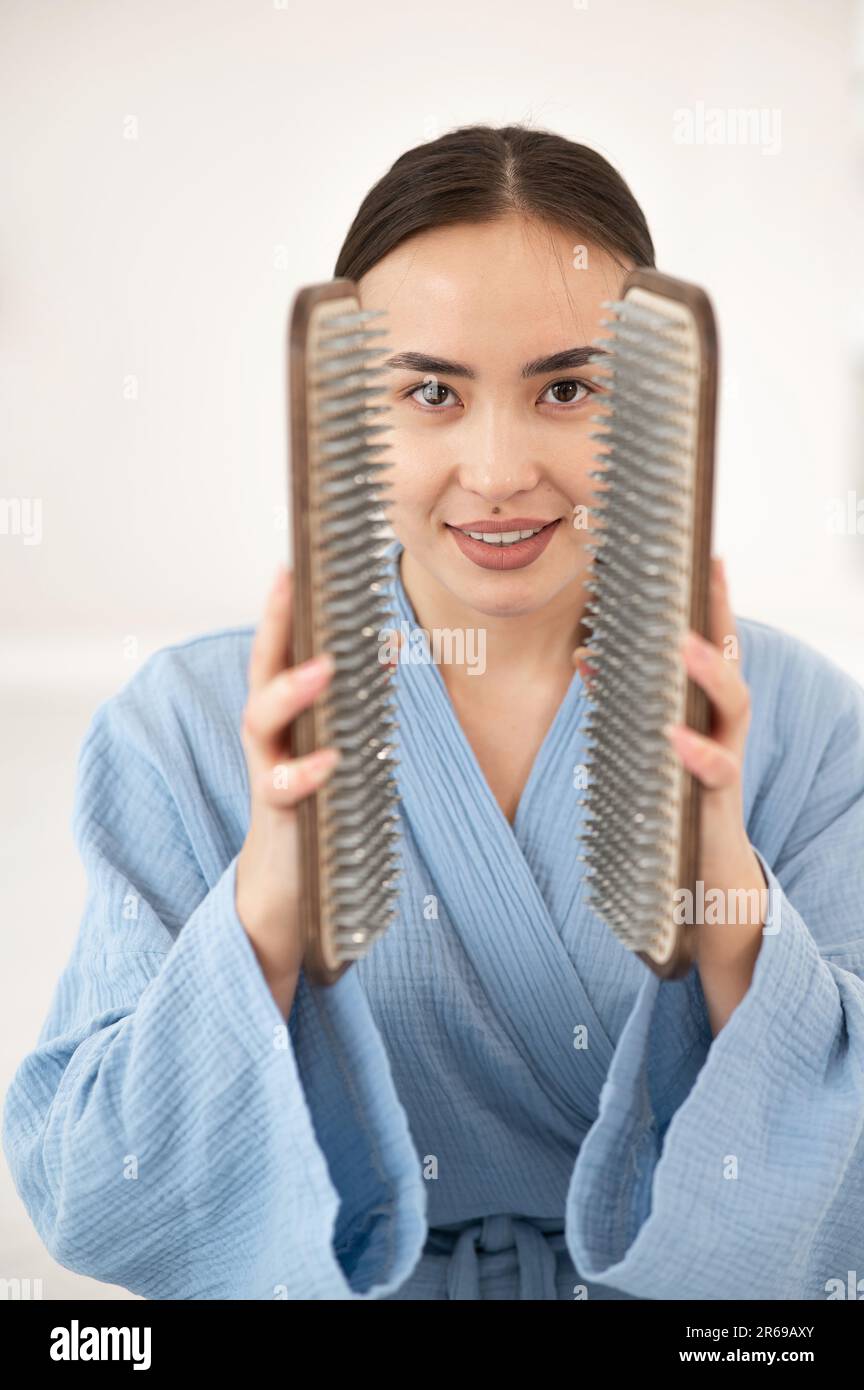 Asian woman holding sadhu boards on face background Stock Photo - Alamy