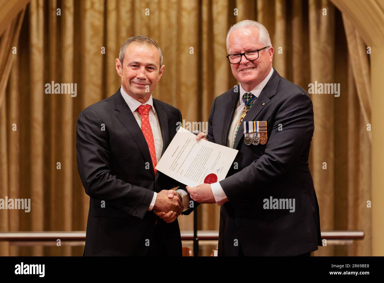 WA Premier Roger Cook (l) poses for a photograph after being sworn in ...