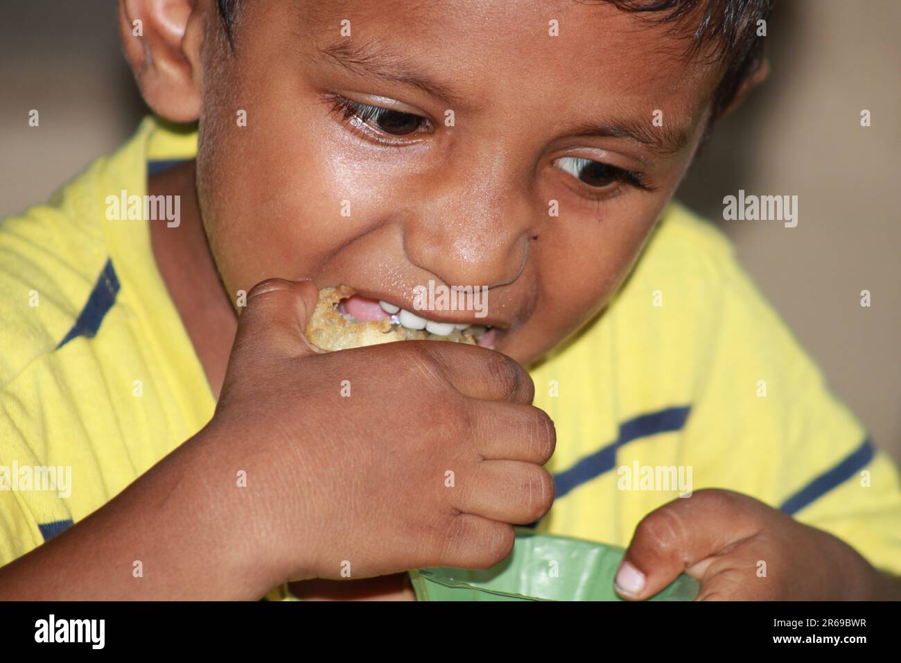 Indian little boy is eating water balls Stock Photo - Alamy