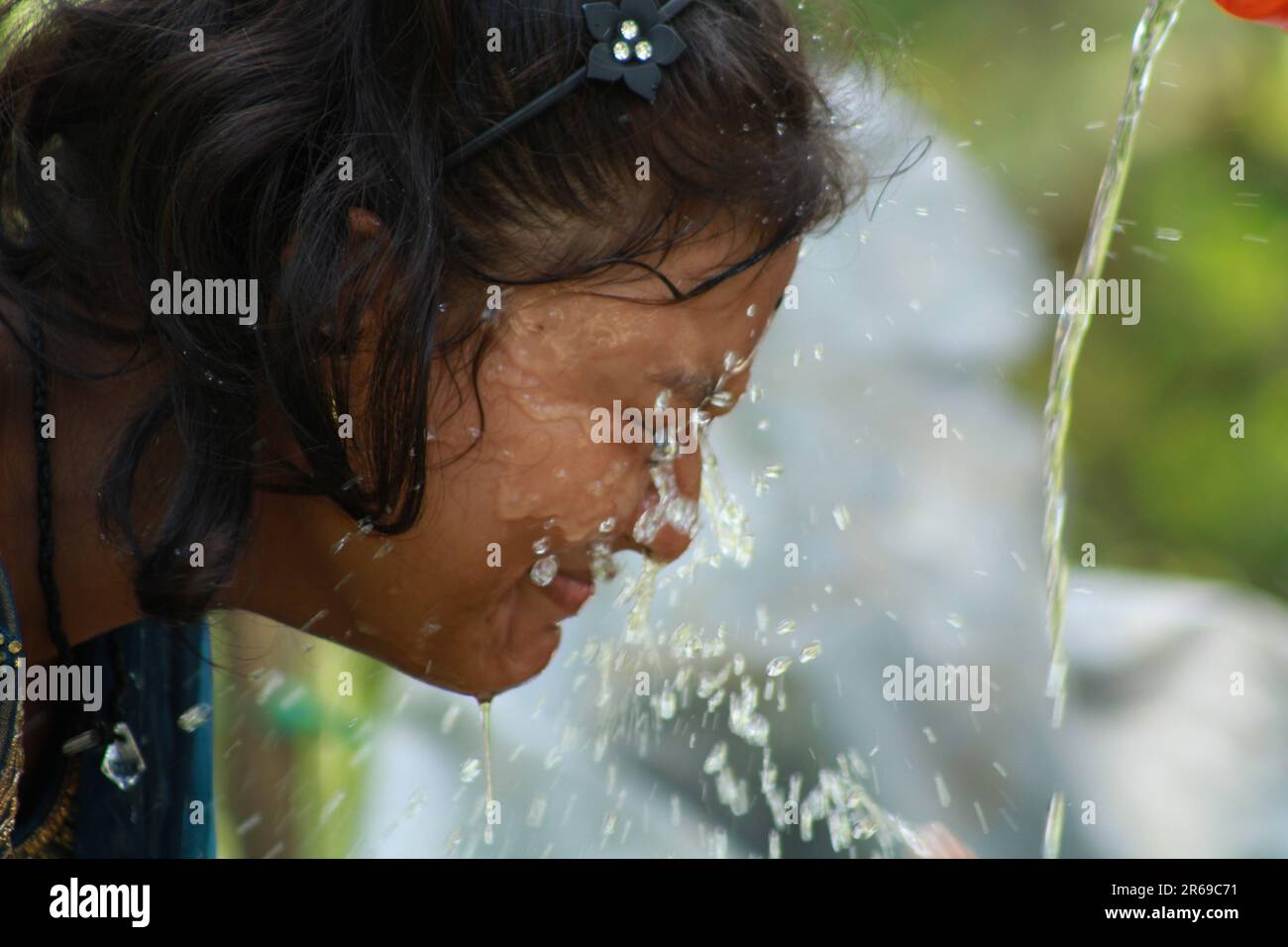 Beautiful indian woman washing face hi-res stock photography and images ...