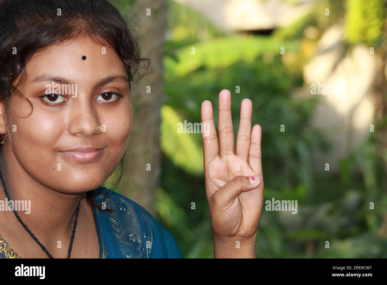 Portrait Of Beautiful Happy Indian Teenage Girl showing and pointing ...