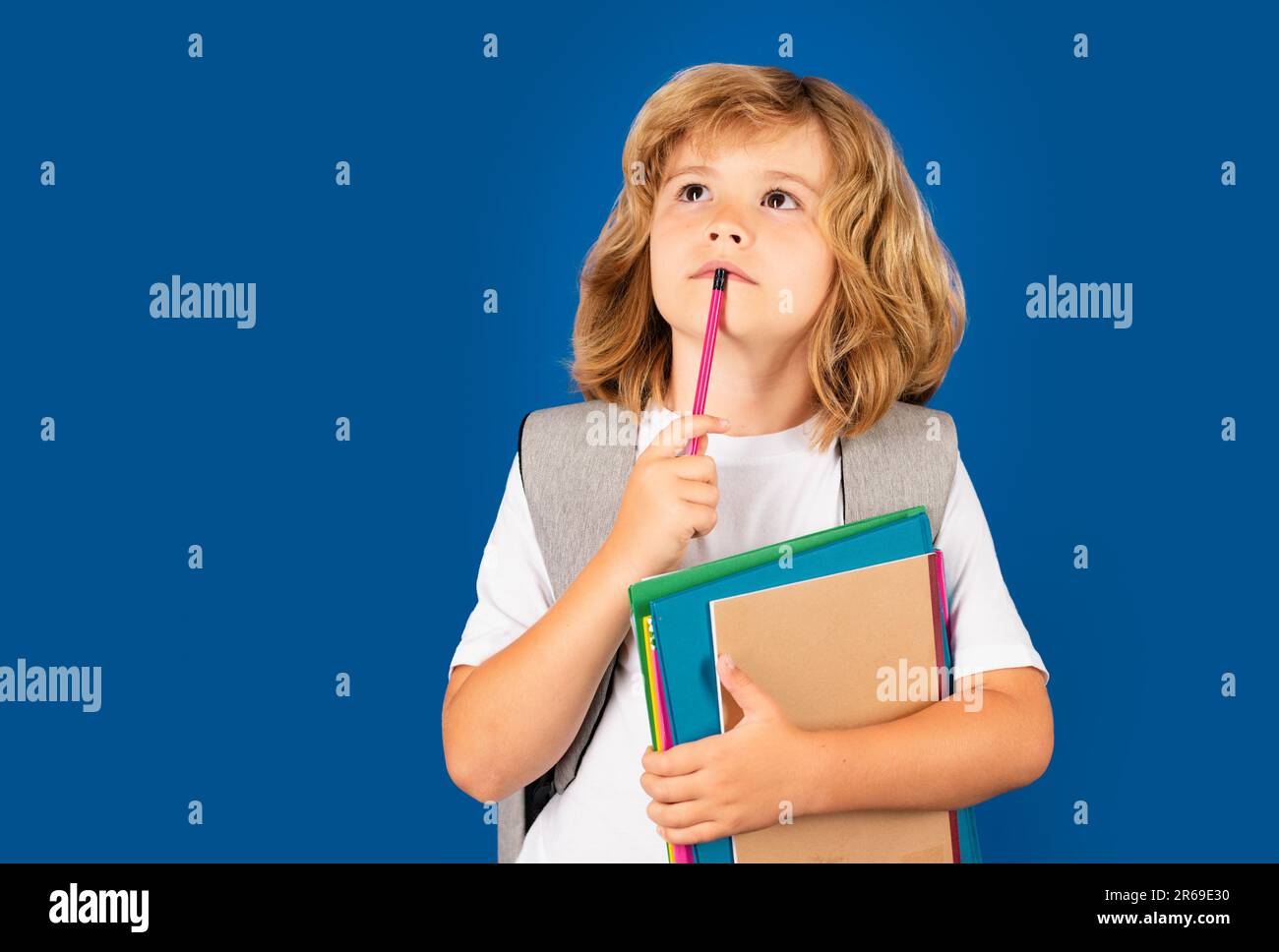School child on isolated background. Thinking pensive kids, thoughtful ...