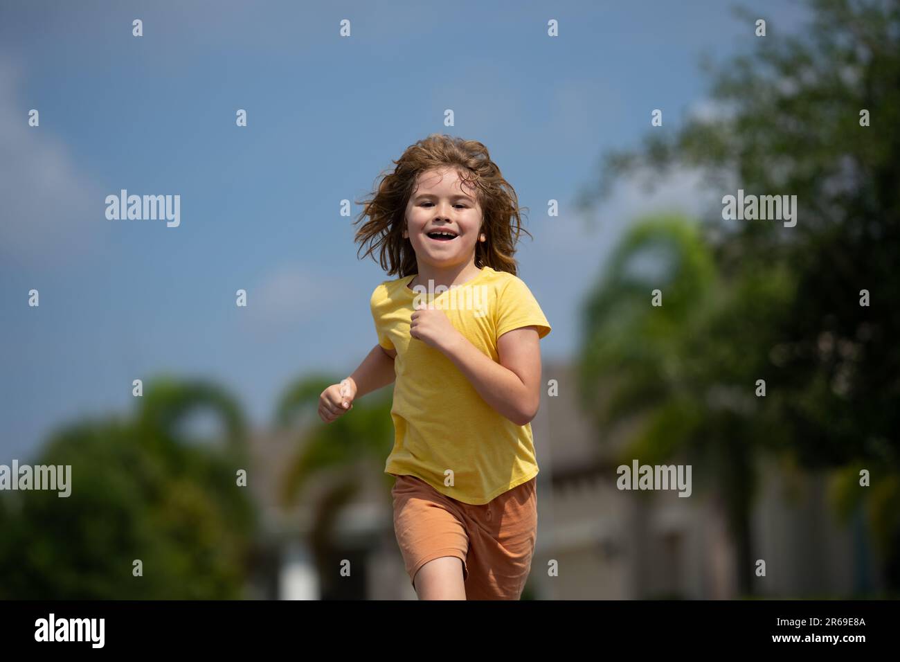 Child running in summer street. Kid enjoy run. Kid running on ...