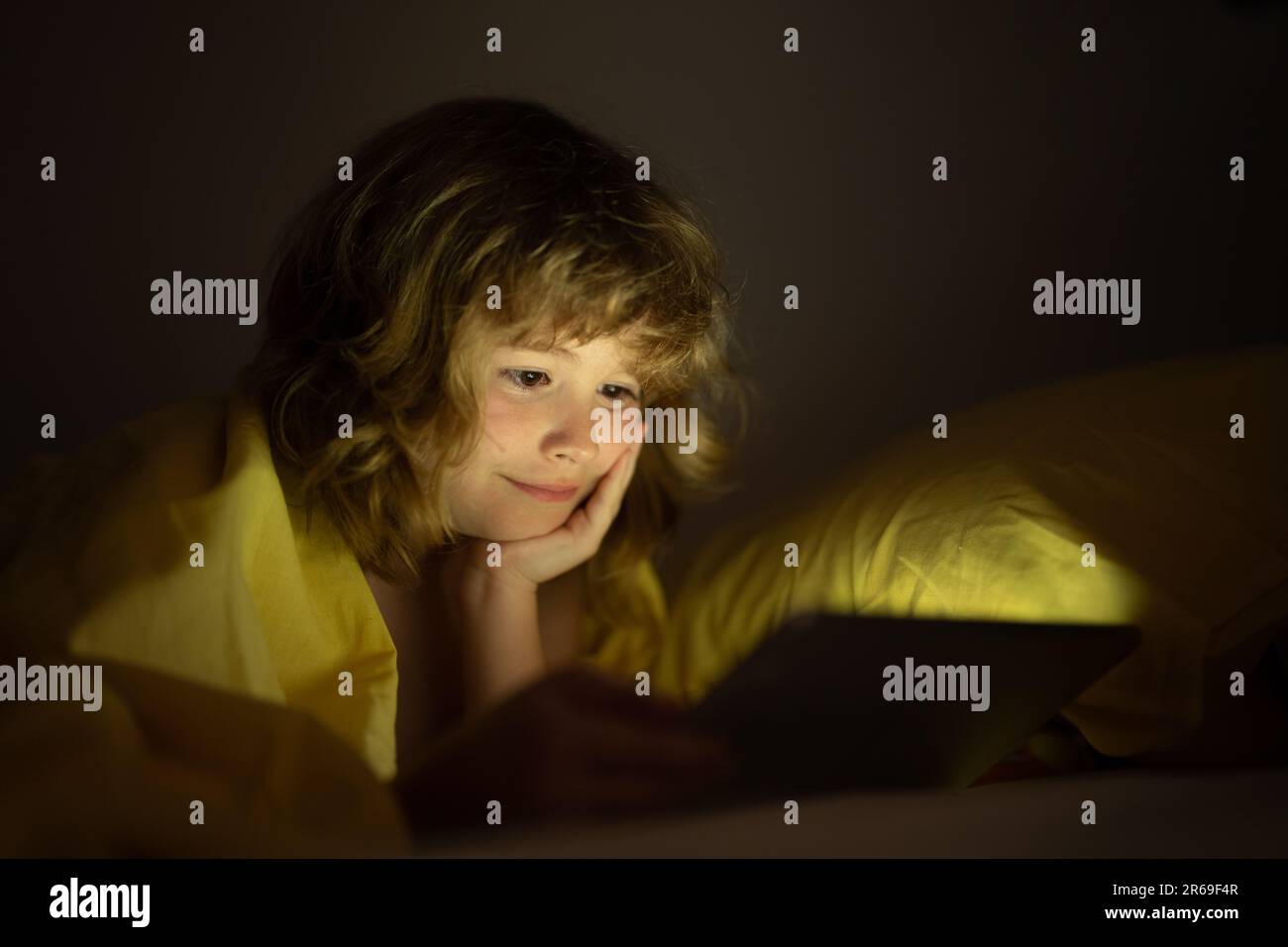 Kid is addicted to tablet, kid use tablet, watching cartoon. Child ...