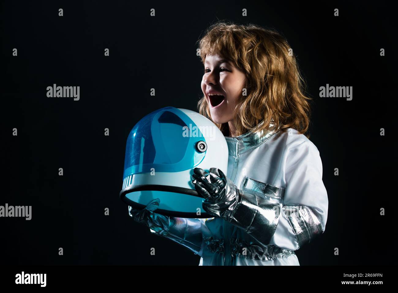 Little boy wearing an astronaut helmet costume and. Cute kid in ...