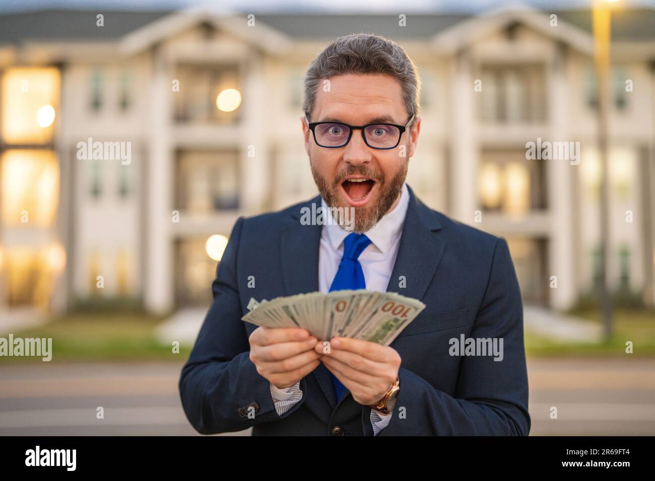 Real estate agent, broker or owner front of property. Outdoor portrait ...