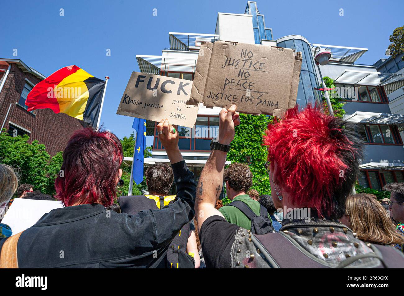 Protesters hold placards during the Sanda Dia protest Black Lives ...